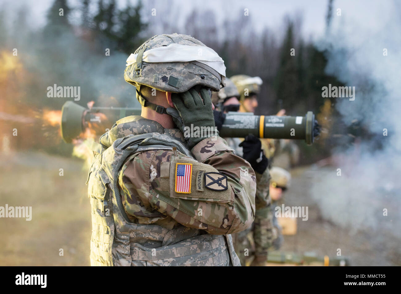 Army Staff Sgt. David Riley, foreground, assigned to the 109th ...