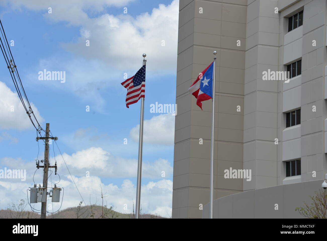 The American and Puerto Rican flags fly together over Caguas, Puerto ...