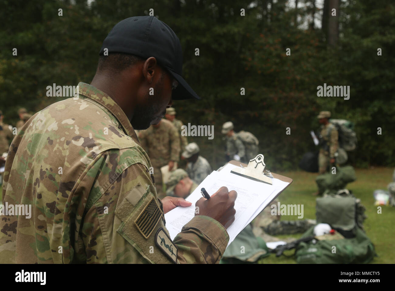 Candidates go through the first day of the Expert Field Medical Badge ...