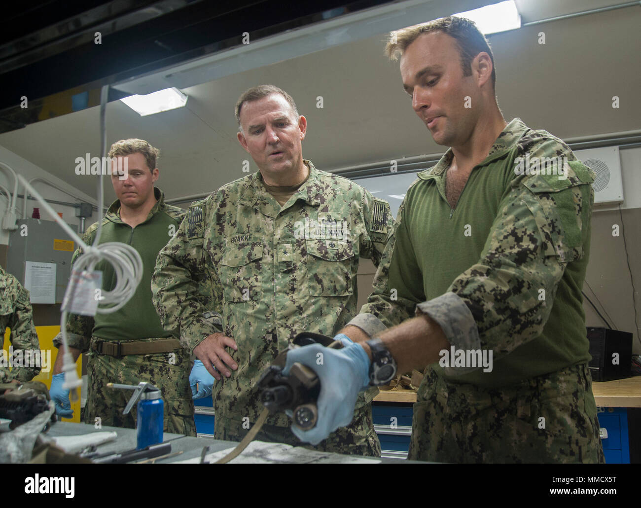 U.S. Navy Chief Explosive Ordnance Disposalman David Bernhardt (right ...