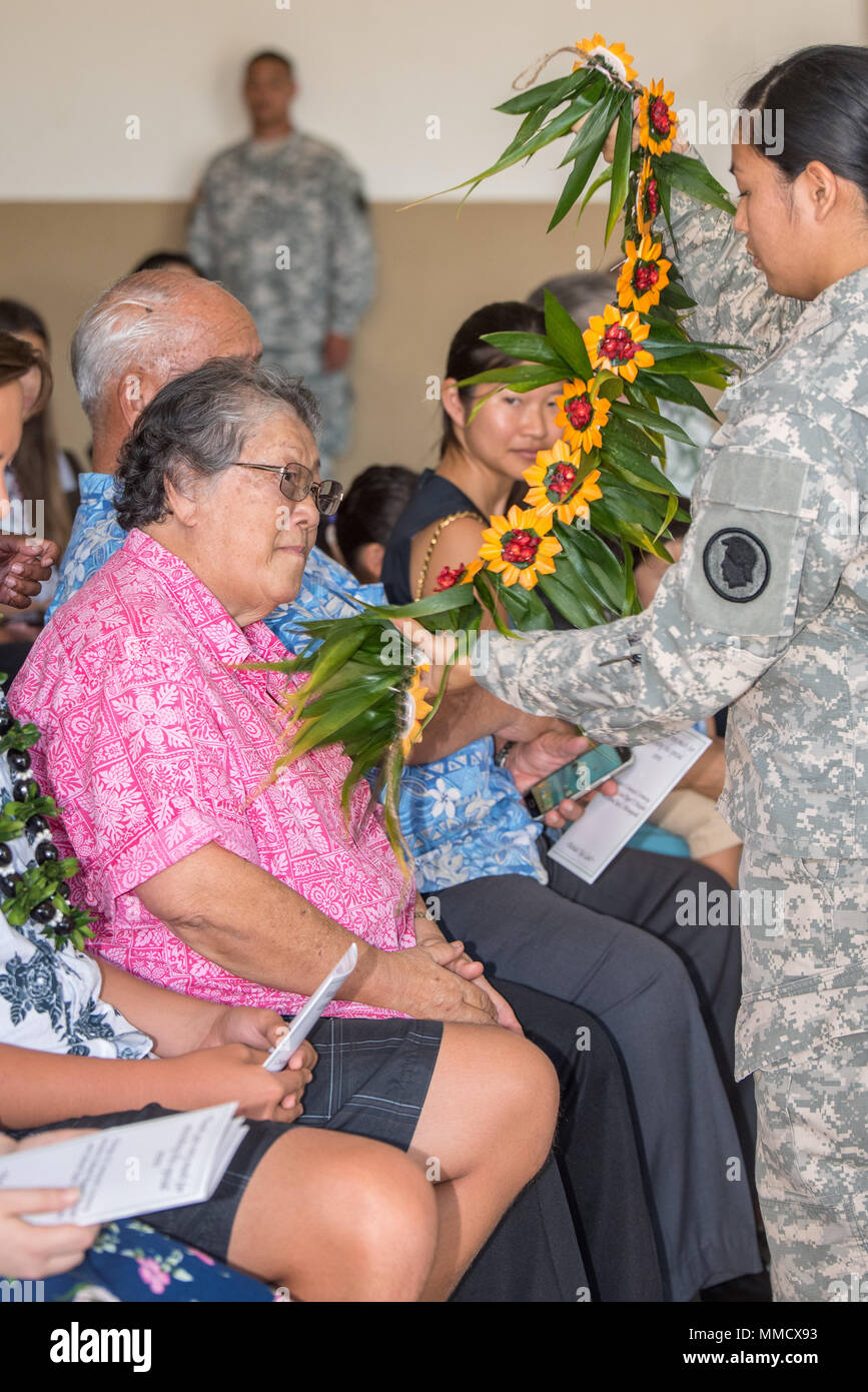 A lei is presented during the 103rd Troop Command change of command ...