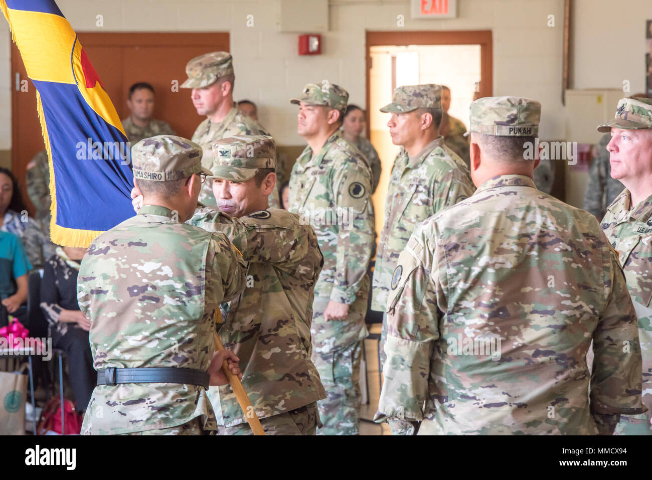 Col. Neal S. Mitsuyoshi receives guidon from Brig. Gen. Keith Y ...