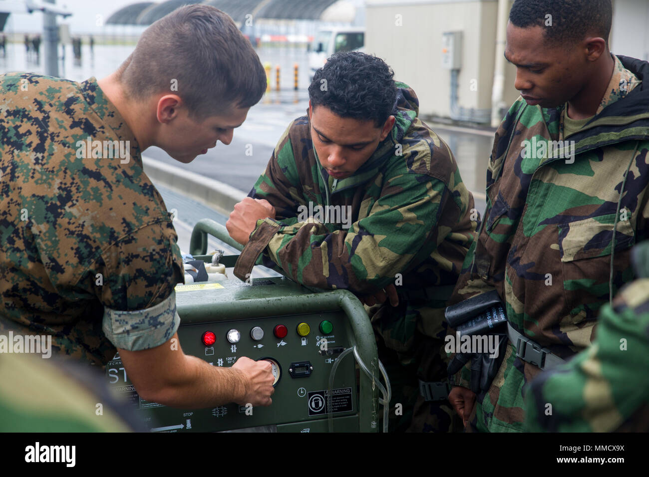 U.S. Marine Corps Cpl. Andrew King, left, a chemical biological ...