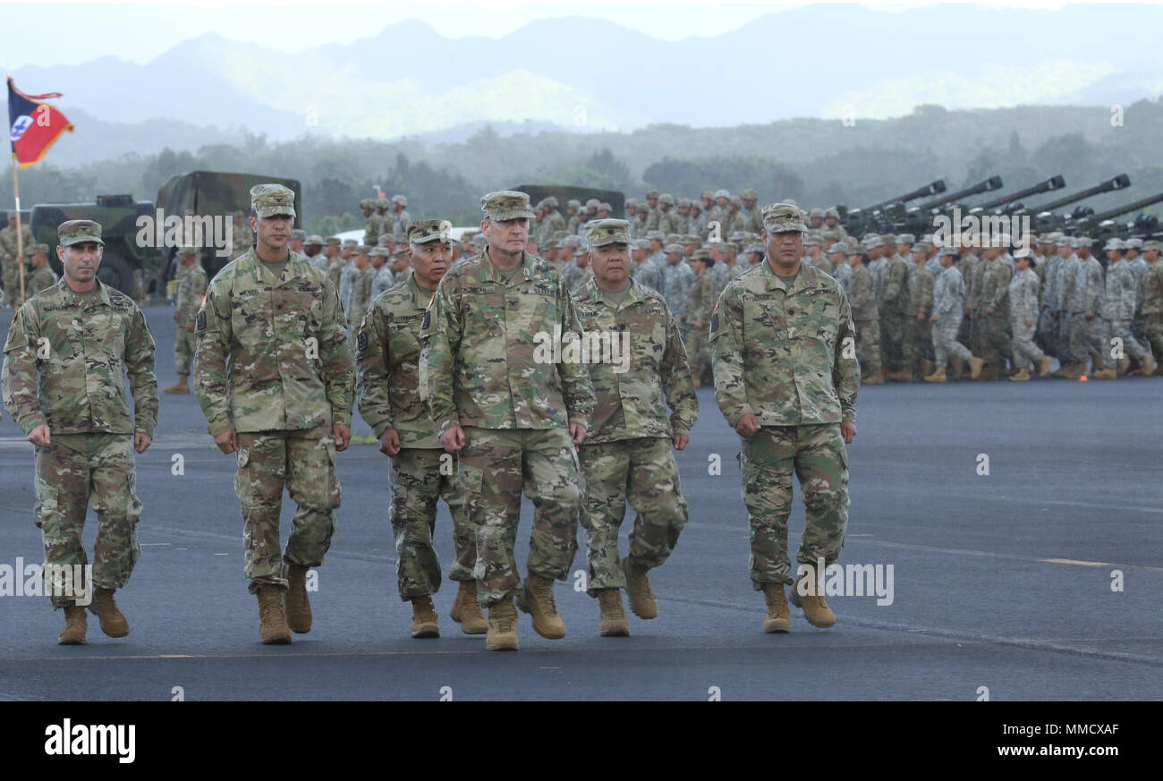 The official detatchment execute a pass and review in honor of Brig ...