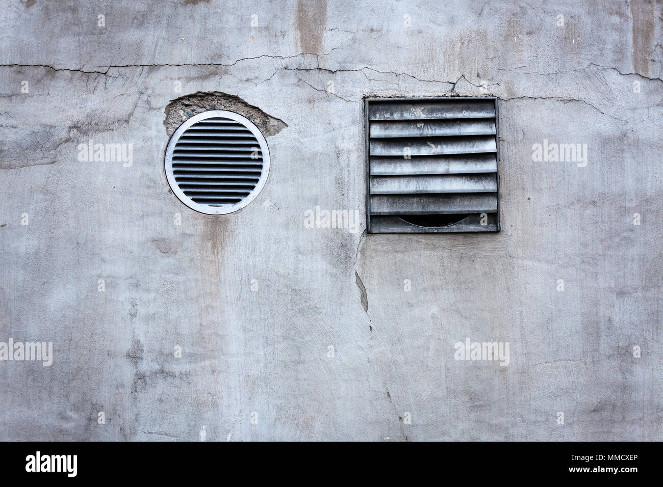 Concrete wall and air vents exterior Stock Photo - Alamy