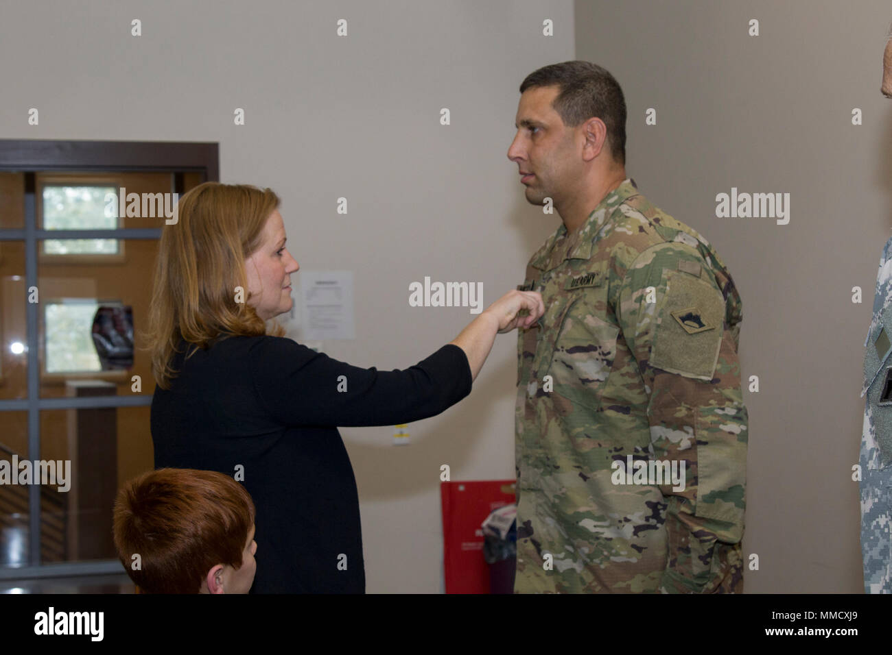 U.S. Army Maj. Doran Metzger, Joint Force Headquarters, Vermont National Guard, is pinned by his ...