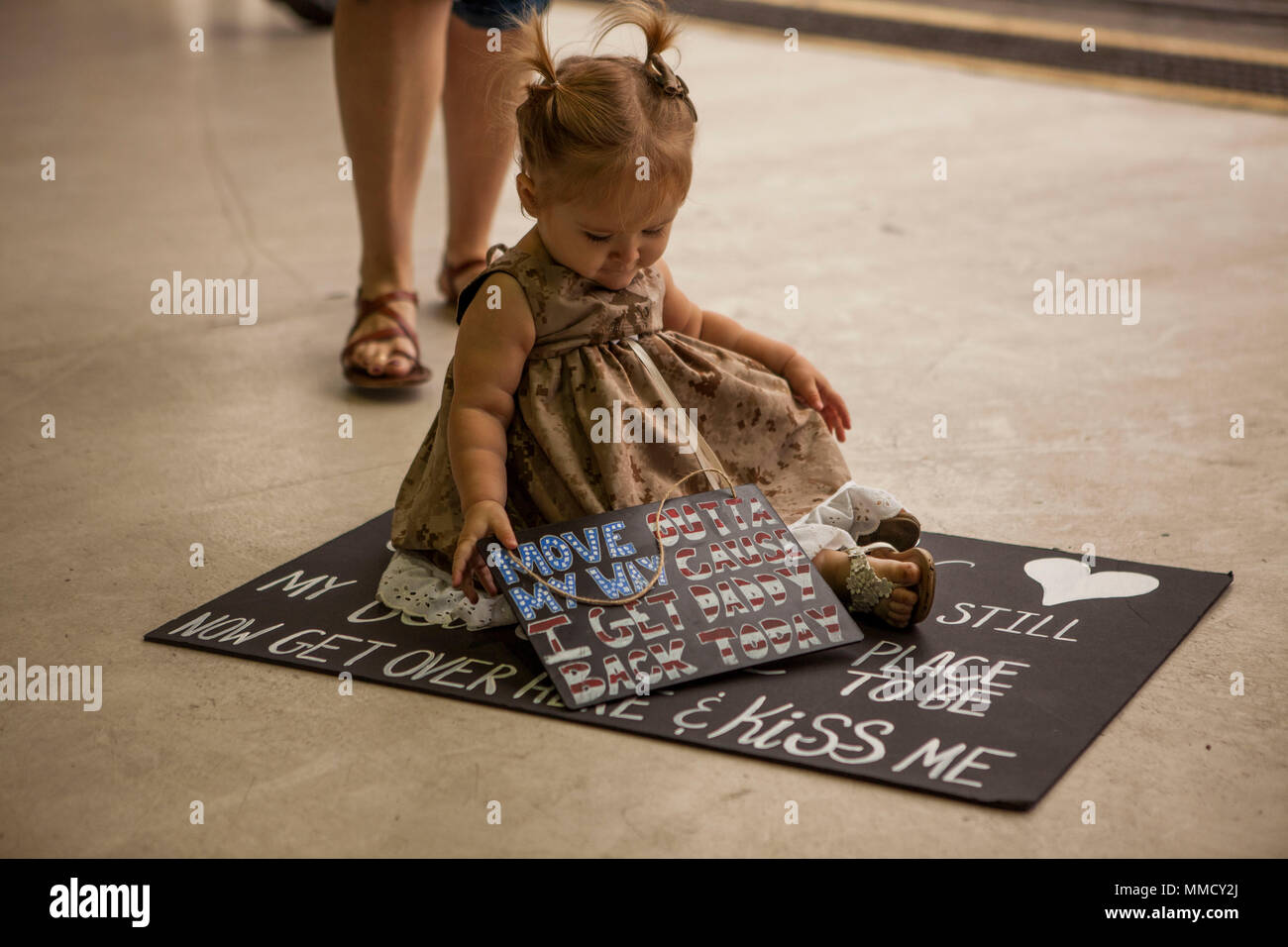 A daughter of a Marine with Marine Tactical Electronic Warfare Squadron ...
