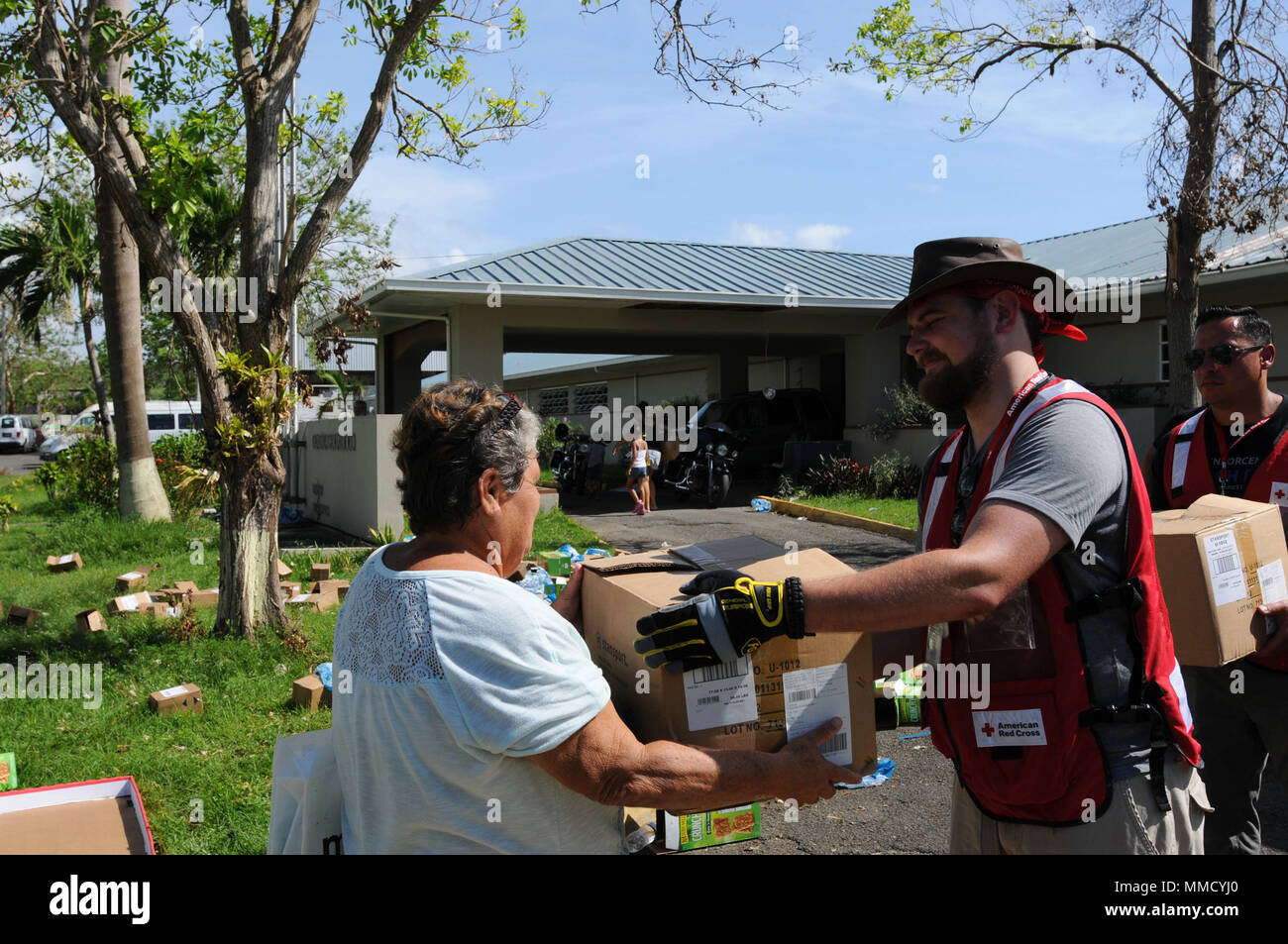 American Red Cross volunteers deliver food and water to a Hurricane ...