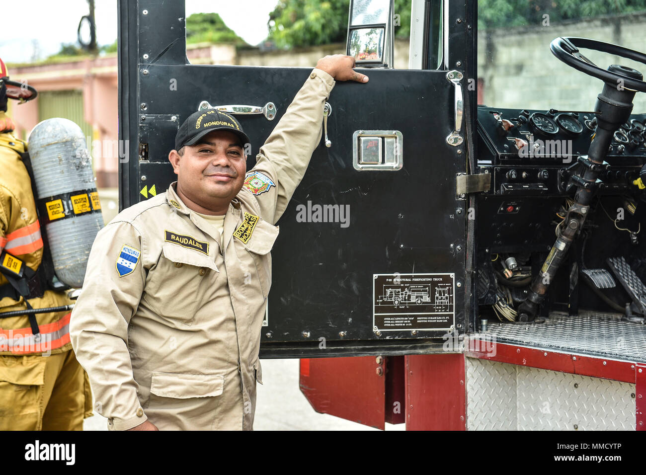 A Honduran firefighters poses for a photo during a parade in Comayagua ...