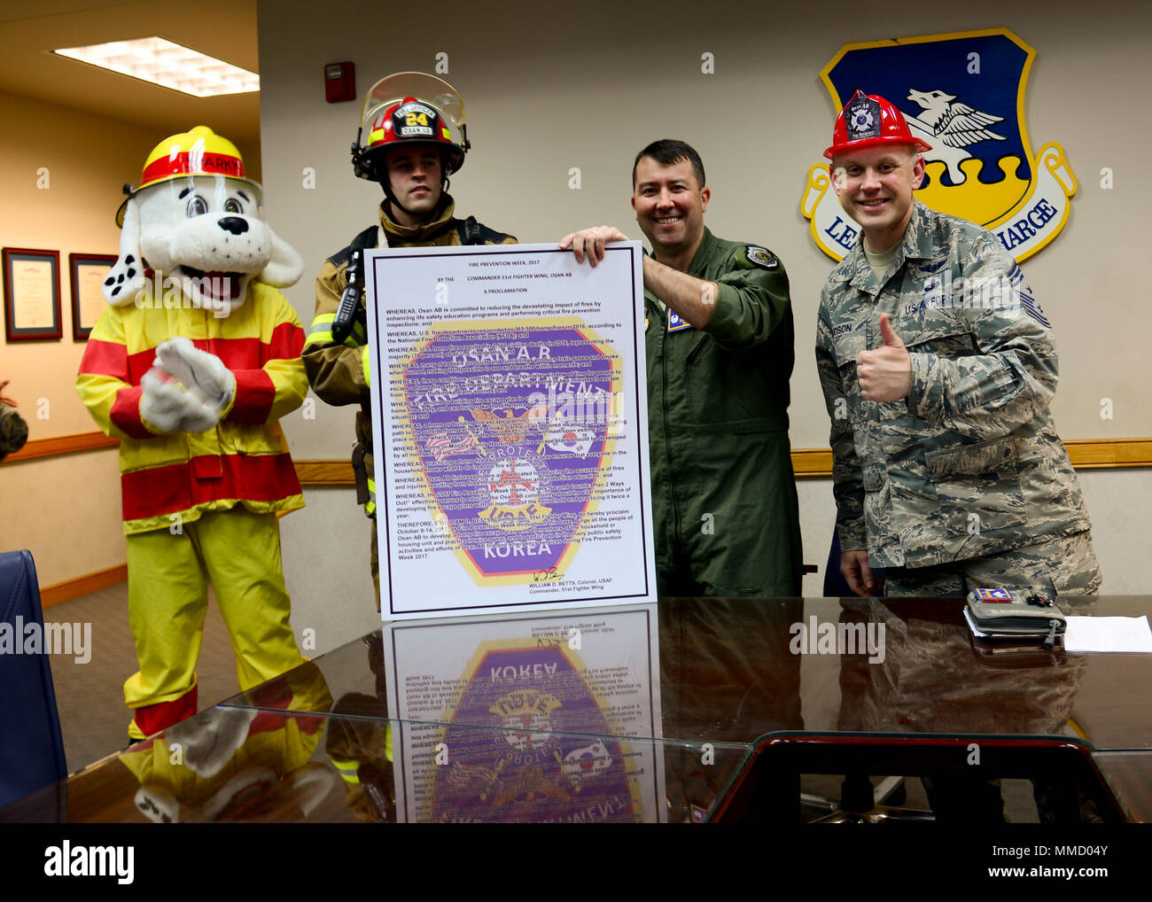 U.S. Air Force Col. William Betts, 51st Fighter Wing commander, signs ...