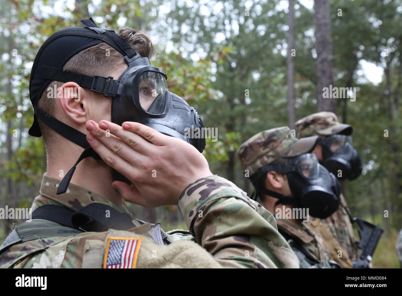 U.S. Army Soldier, clears his Pro mask during the Expert Field Medical ...