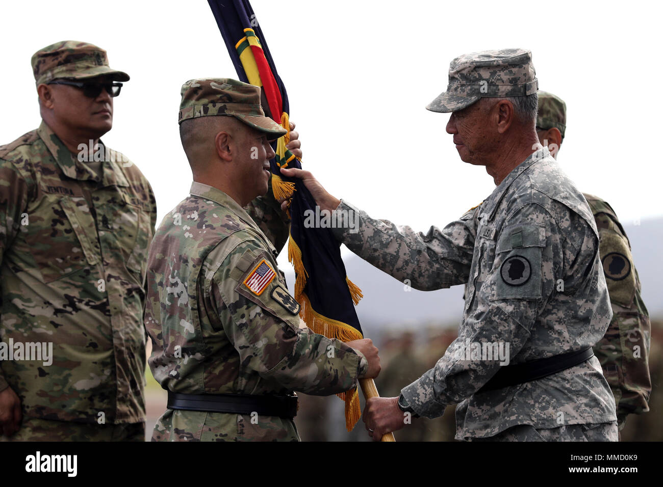 Retired Maj. Gen. Robert G.F. Lee passes the guidon to Brig. Gen ...