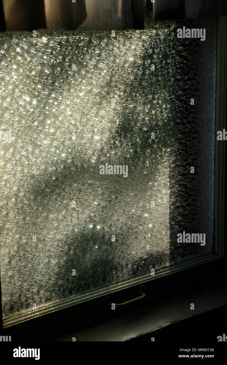 Opaque bathroom window in cottage Stock Photo - Alamy