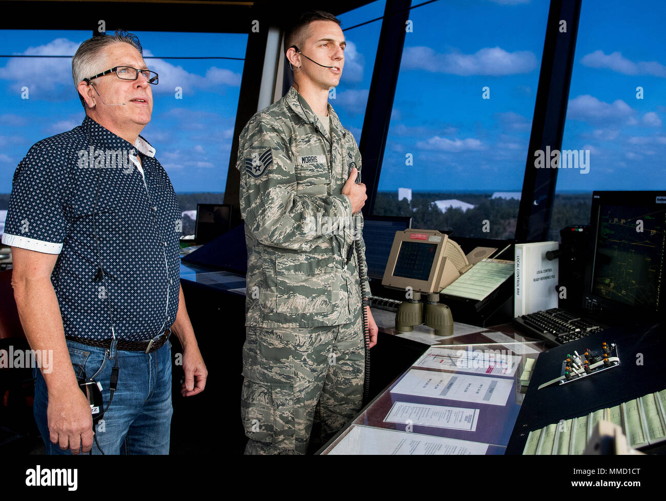 Steven Kates watches the Duke Field airspace as Staff Sgt. Brian Morris ...