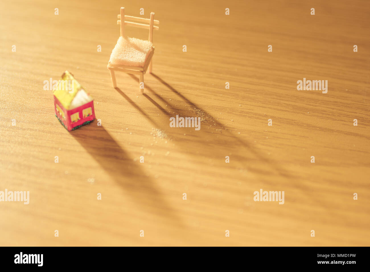 Small toys house and chair Stock Photo - Alamy