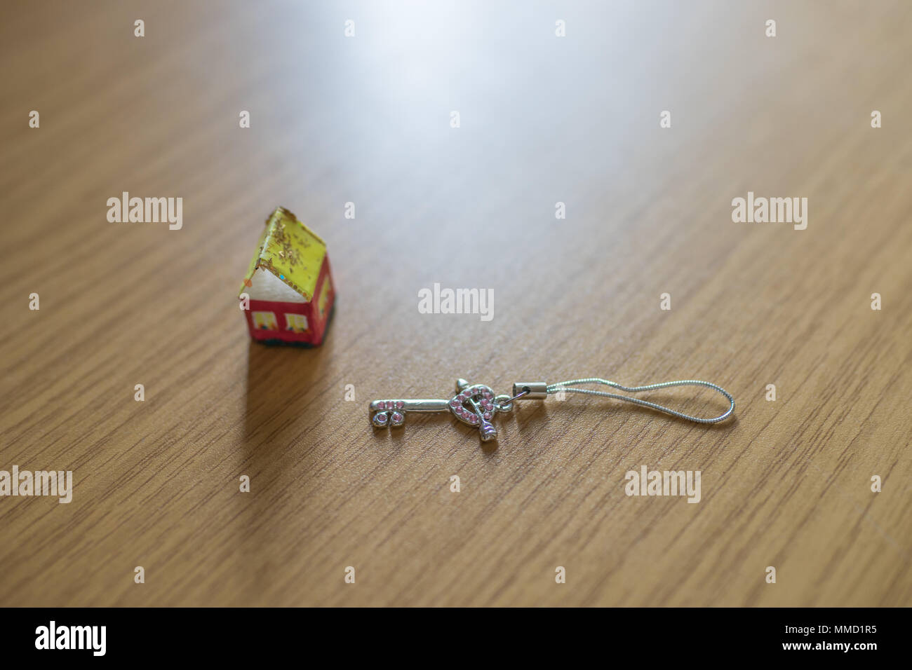 Small house and key Stock Photo - Alamy