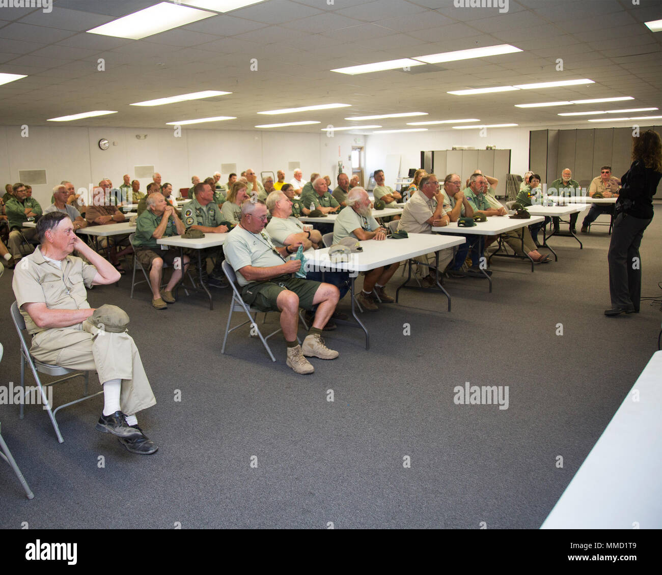Members of the Military Vehicle Preservation Association, listen as ...