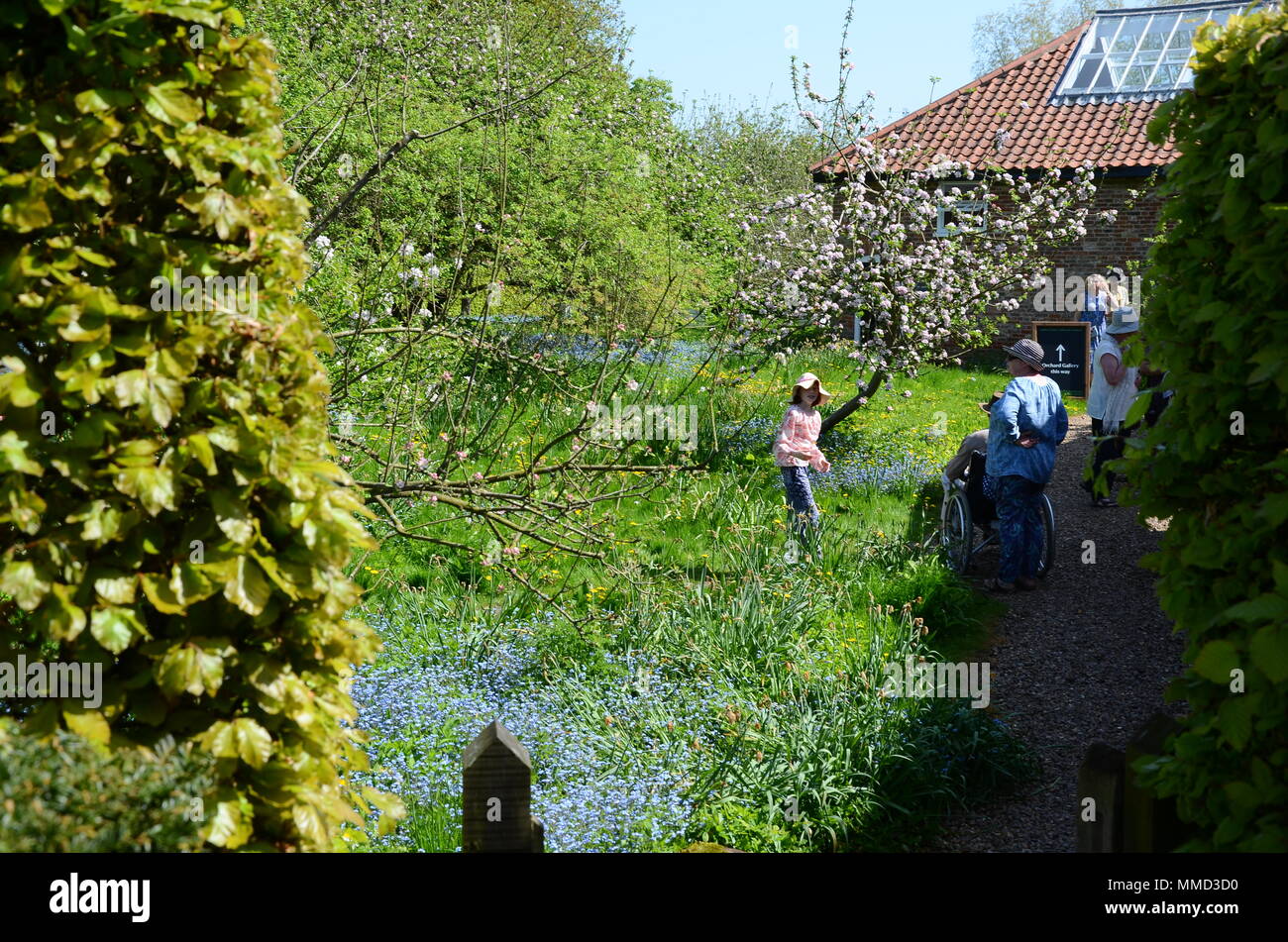 Visitors touring the gardens at Gunby Hall in Spring, Lincolnshire, UK ...