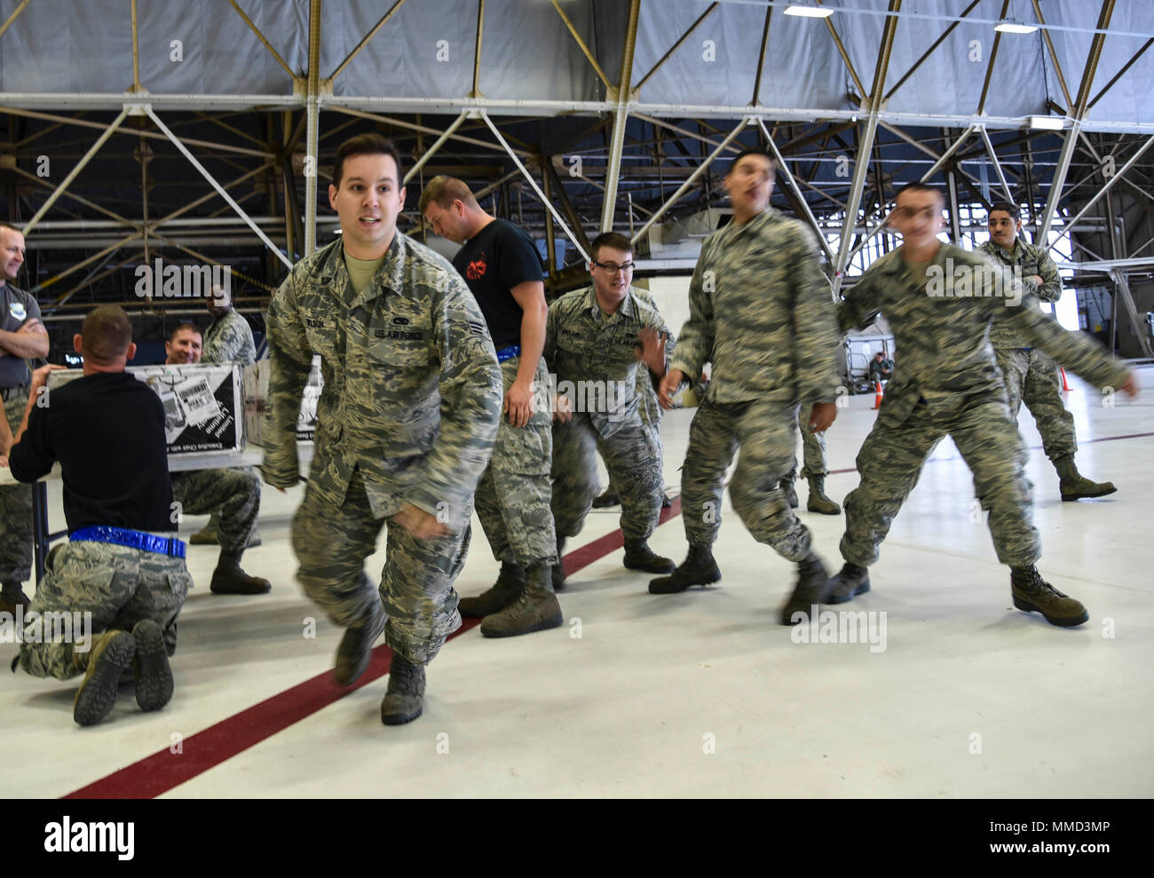Airman Ryan Wilson (center), Aerospace Ground Equipment maintainers ...