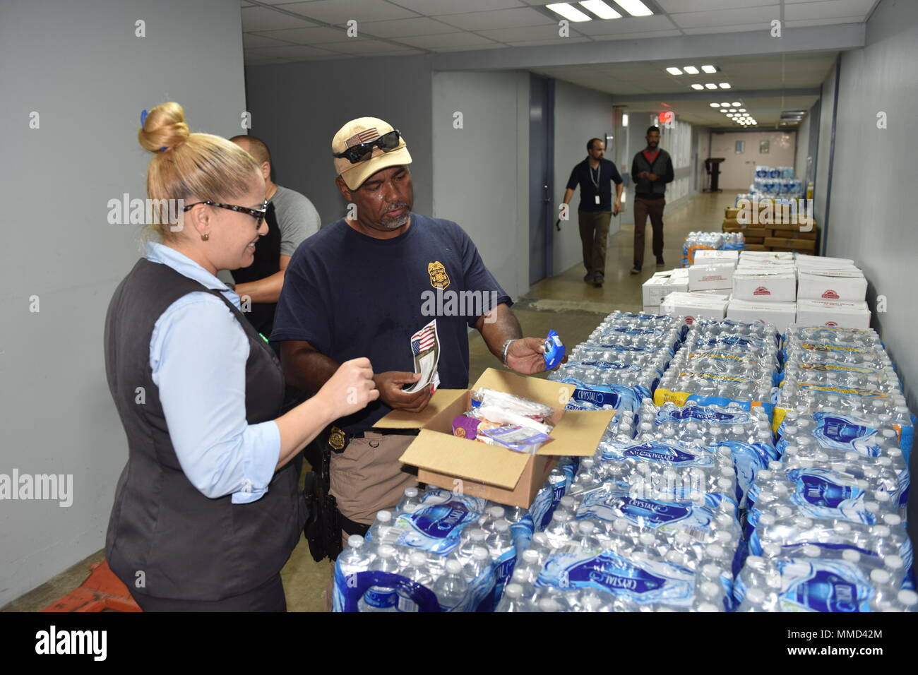 A member of Coast Guard Investigative Services reviews inventory of ...