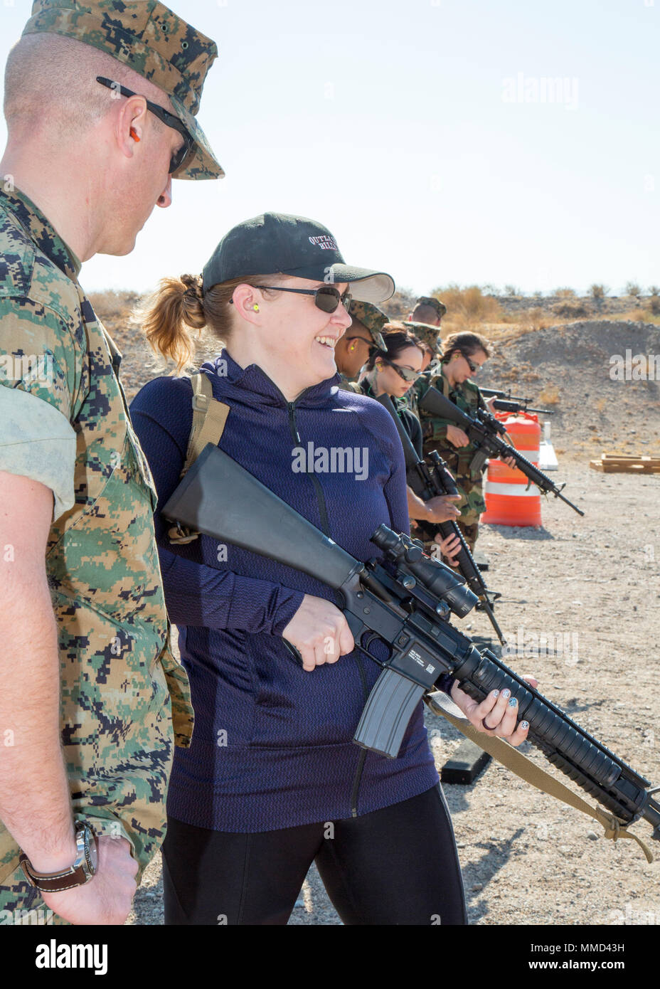 Major Christian Carlson, operations officer, helps his wife, Casey ...