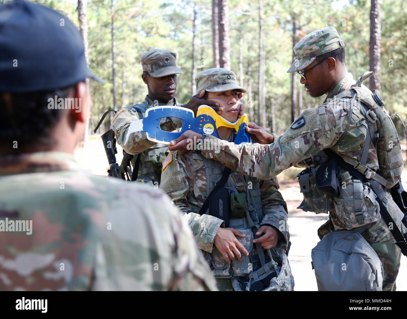 U.S. Army Candidates practice assesing a casualty for the Expert Field ...