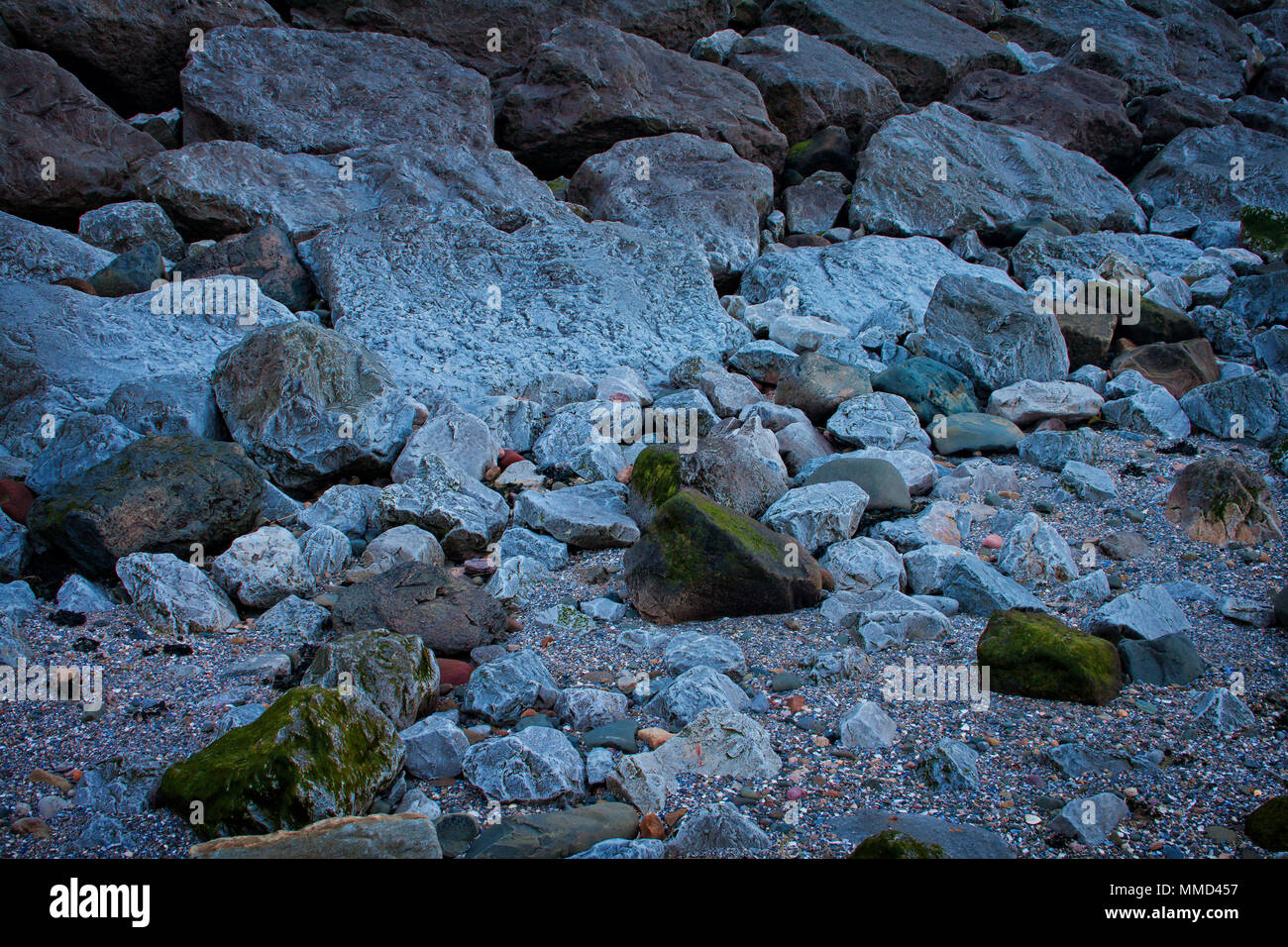 Sea-washed rocks on the shore at Cockersands have a luminous character ...