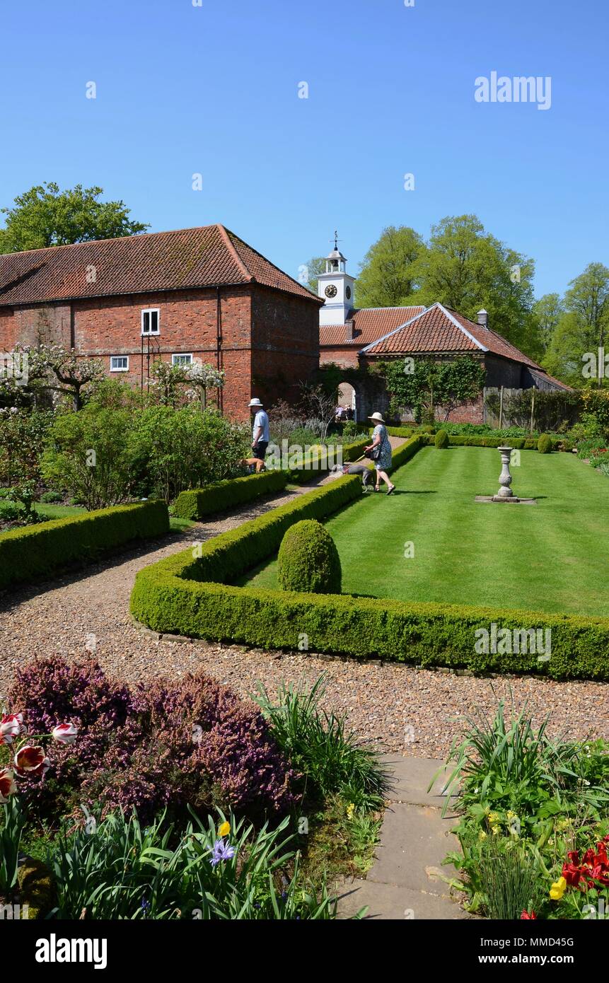 Tourists enjoying the house and gardens at Gunby Hall, Lincolnshire, UK ...