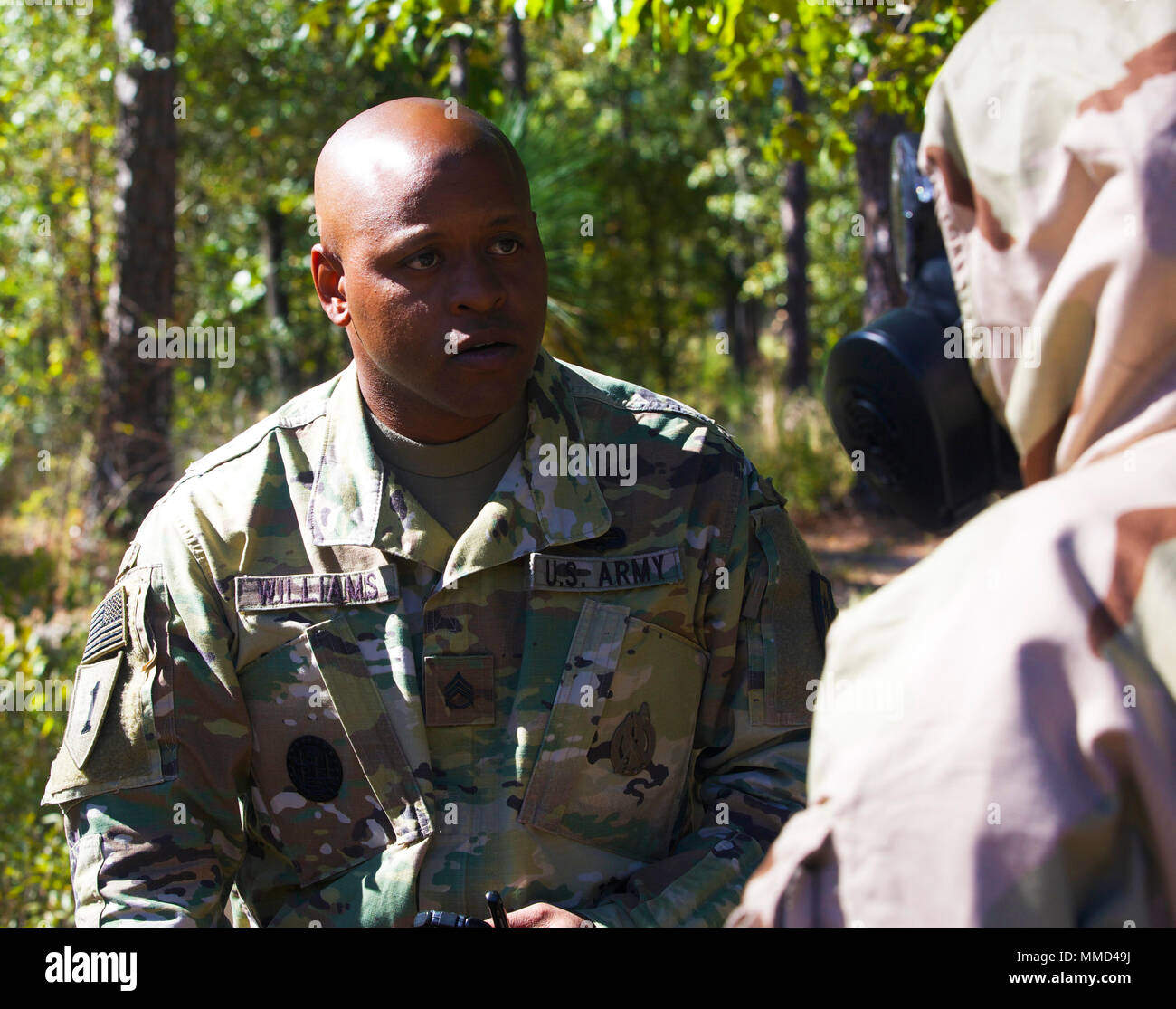 U.S. Army soldier instructs a candidate during the Expert Field Medical ...