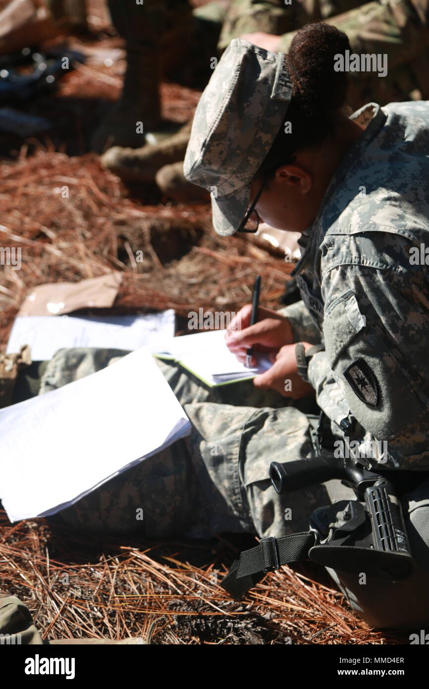 U.S. Army Soldier reviews and writes her notes during the Expert Field ...