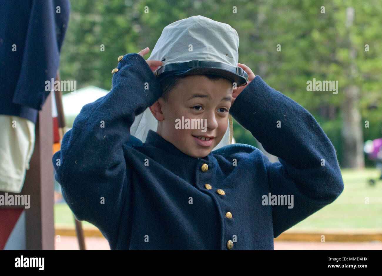 SCHOFIELD BARRACKS — Caleb Benavente, 9, tries on a uniform in the ...