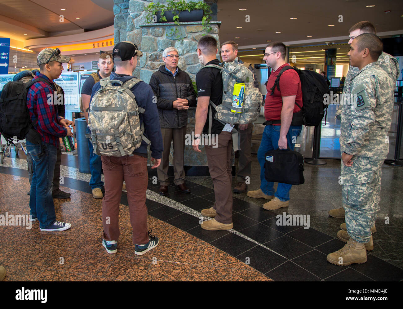 Alaska Army National Guard members are greeted by Lt. Gov. Byron ...