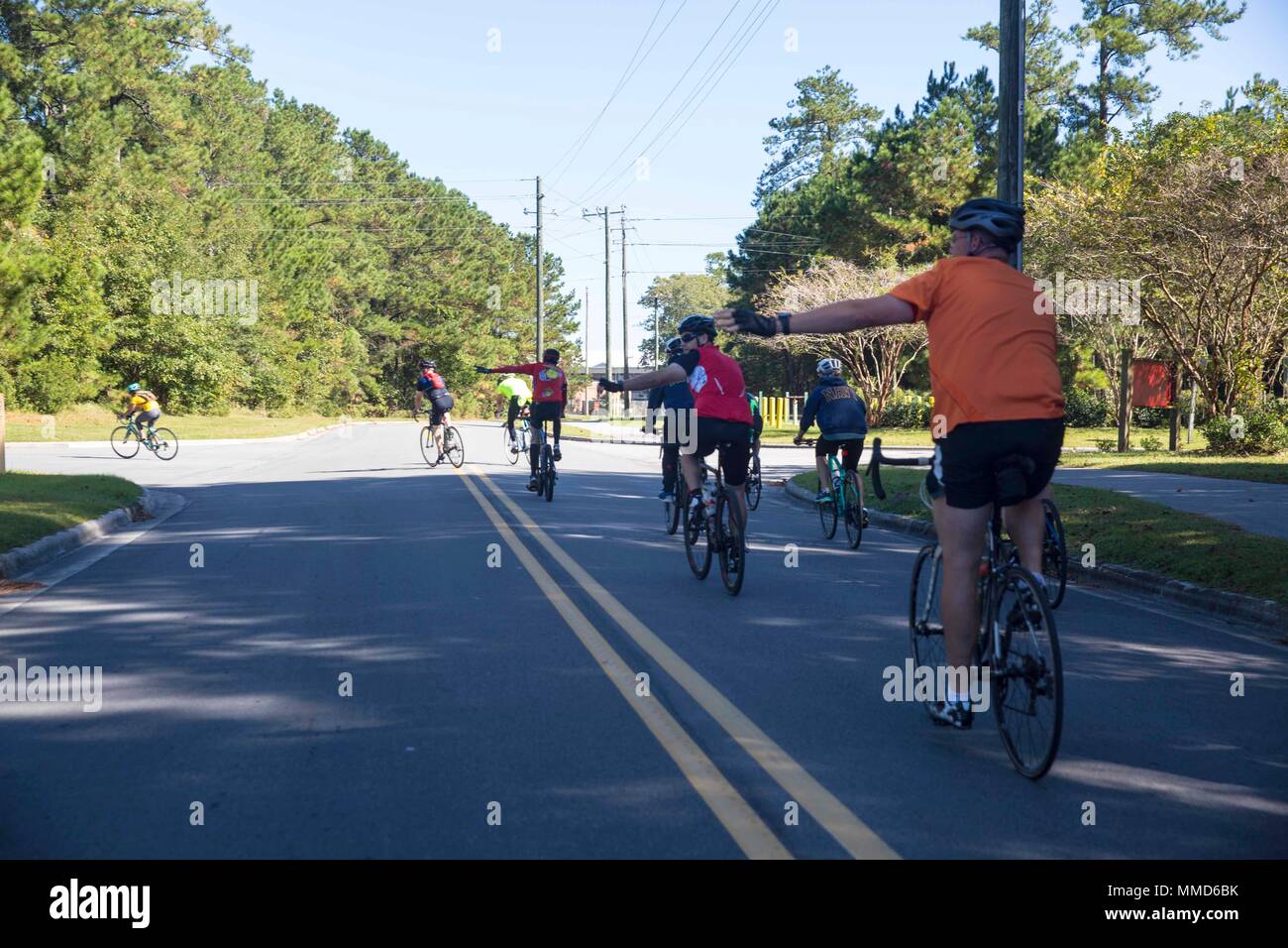 Marines and Sailors signal for a left turn during 2nd Marine Logistics ...