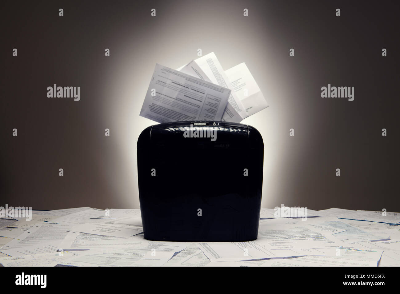 Office shredder on pile of paperwork with personal documents being shredded Stock Photo - Alamy