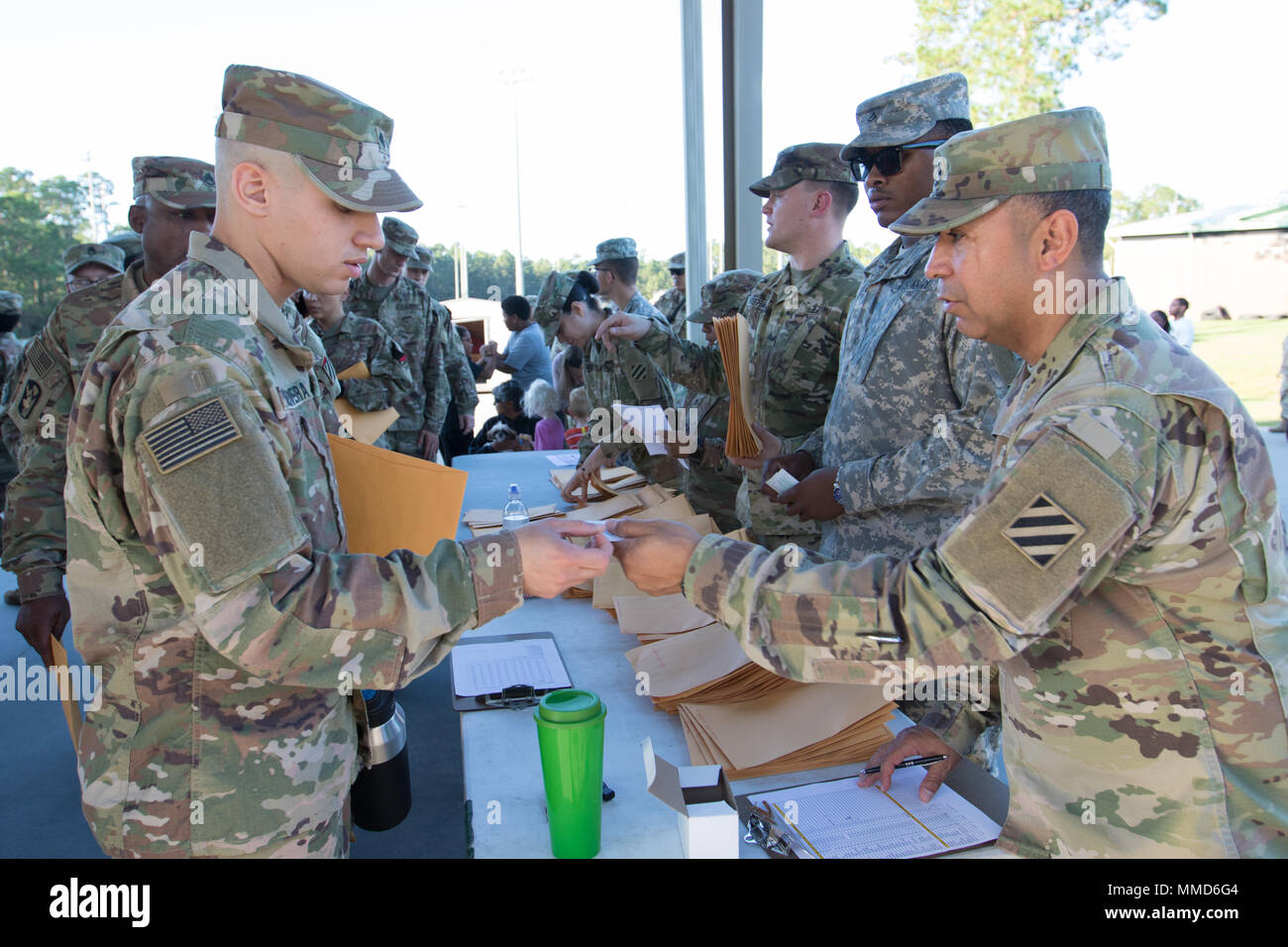 Spc. Erick De Oliveira (left), a paralegal with 3rd Infantry Division ...