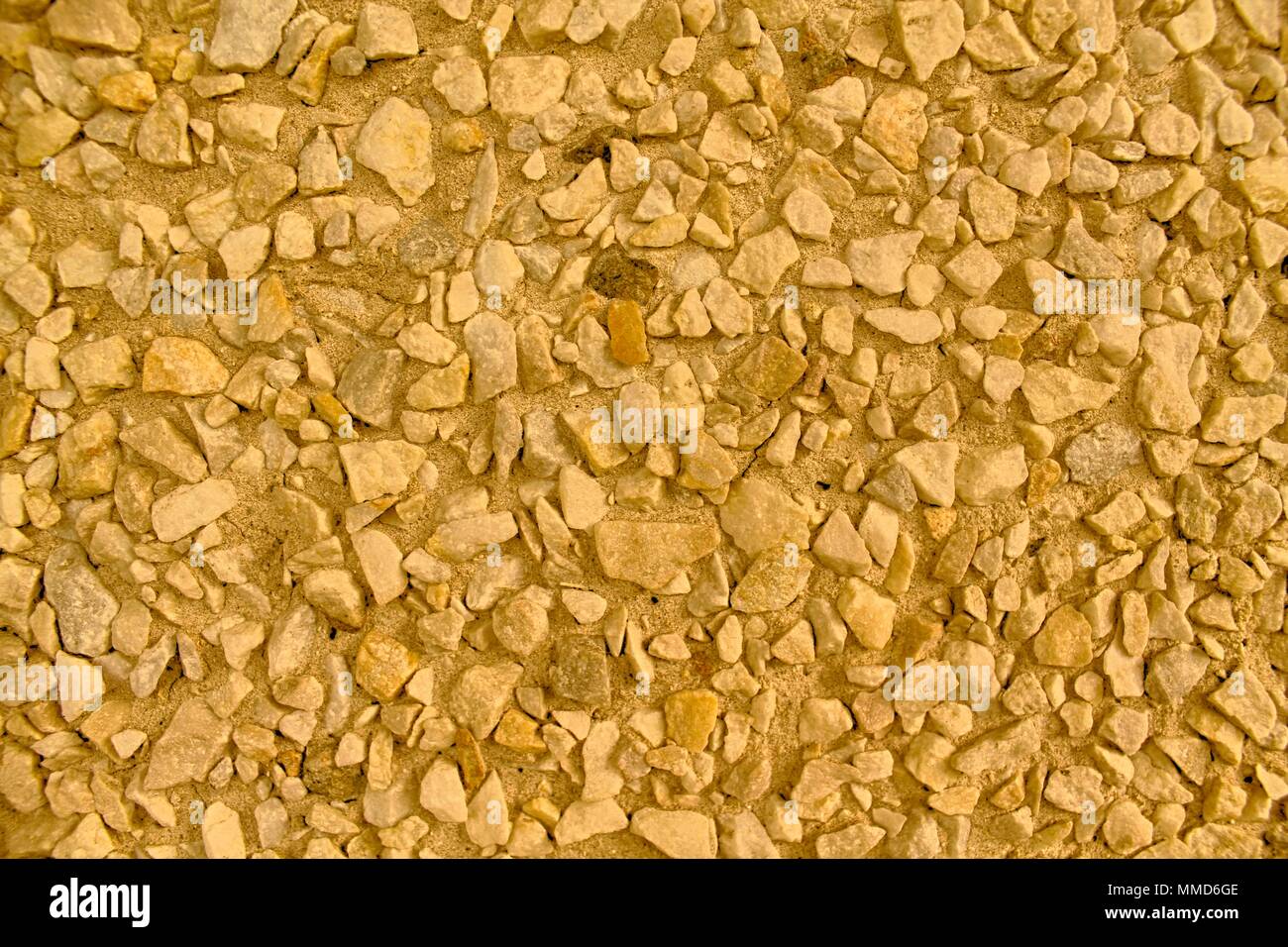 Ultra yellow Pebble textured surface, stone backdrop and boulder ...