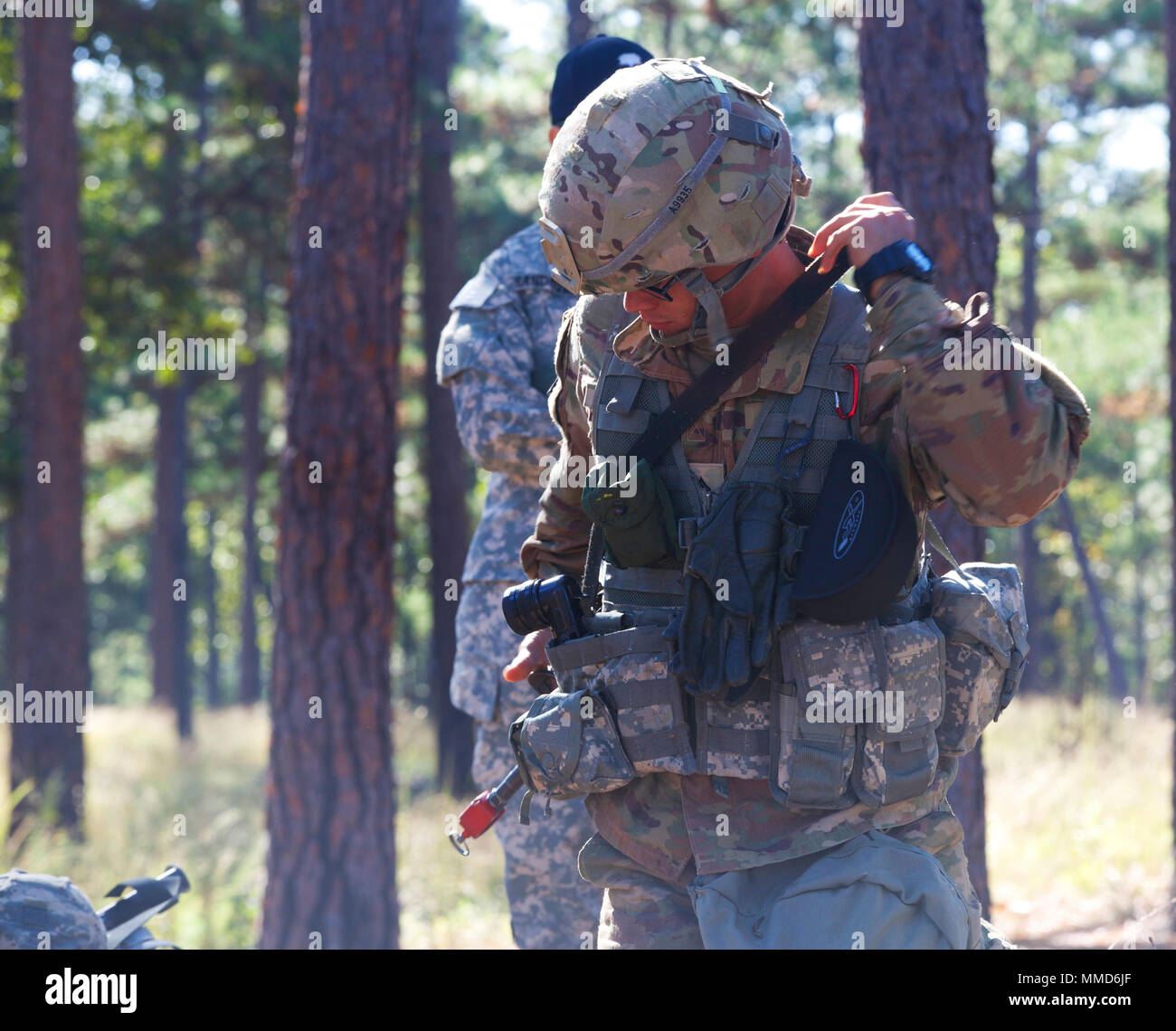 U.S. Army soldier secures his gear during the Expert Field Medical ...