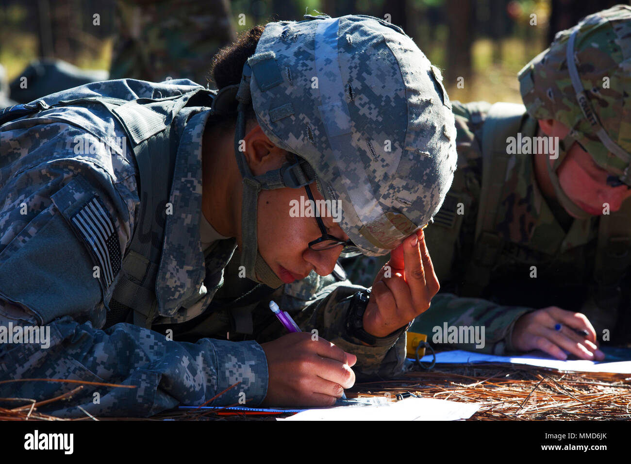 U.S. Army soldier studies their land navigation test during the Expert ...