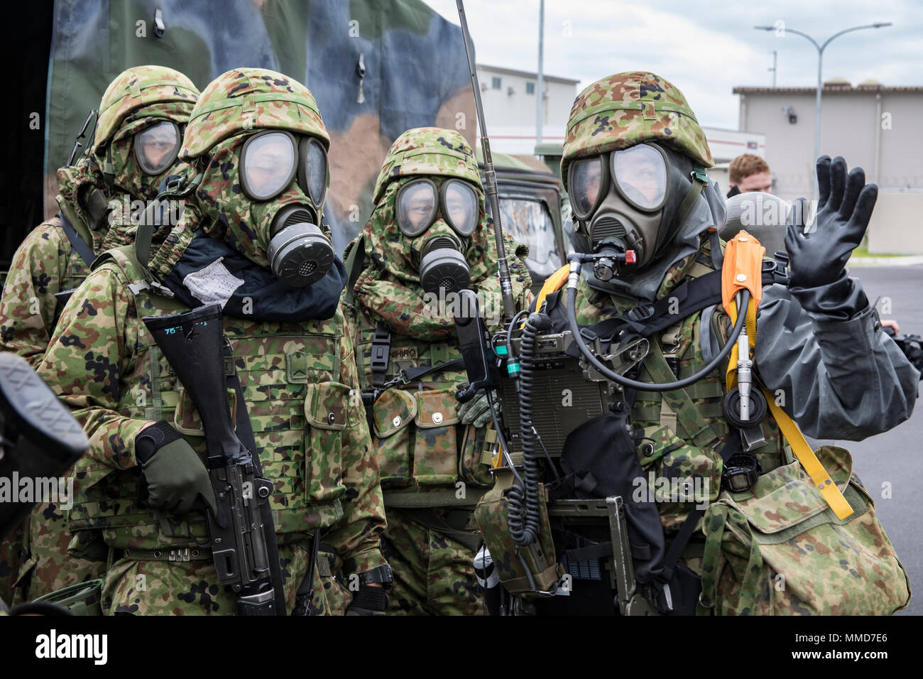 U.S. Marines and Japan Ground-Self Defense Force Soldiers respond to a ...