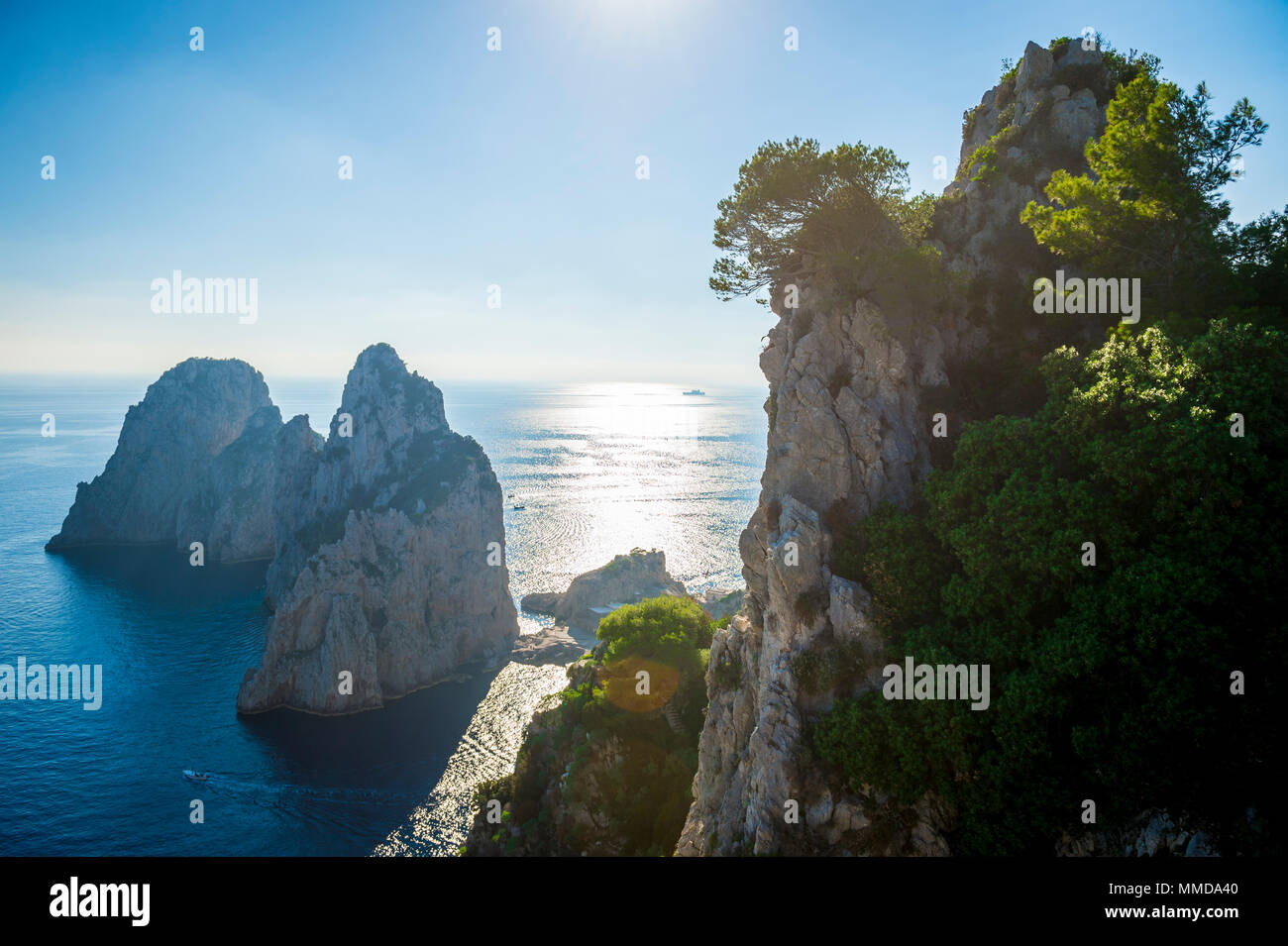 Bright scenic view of the iconic Faraglioni rocks from the nearby ...