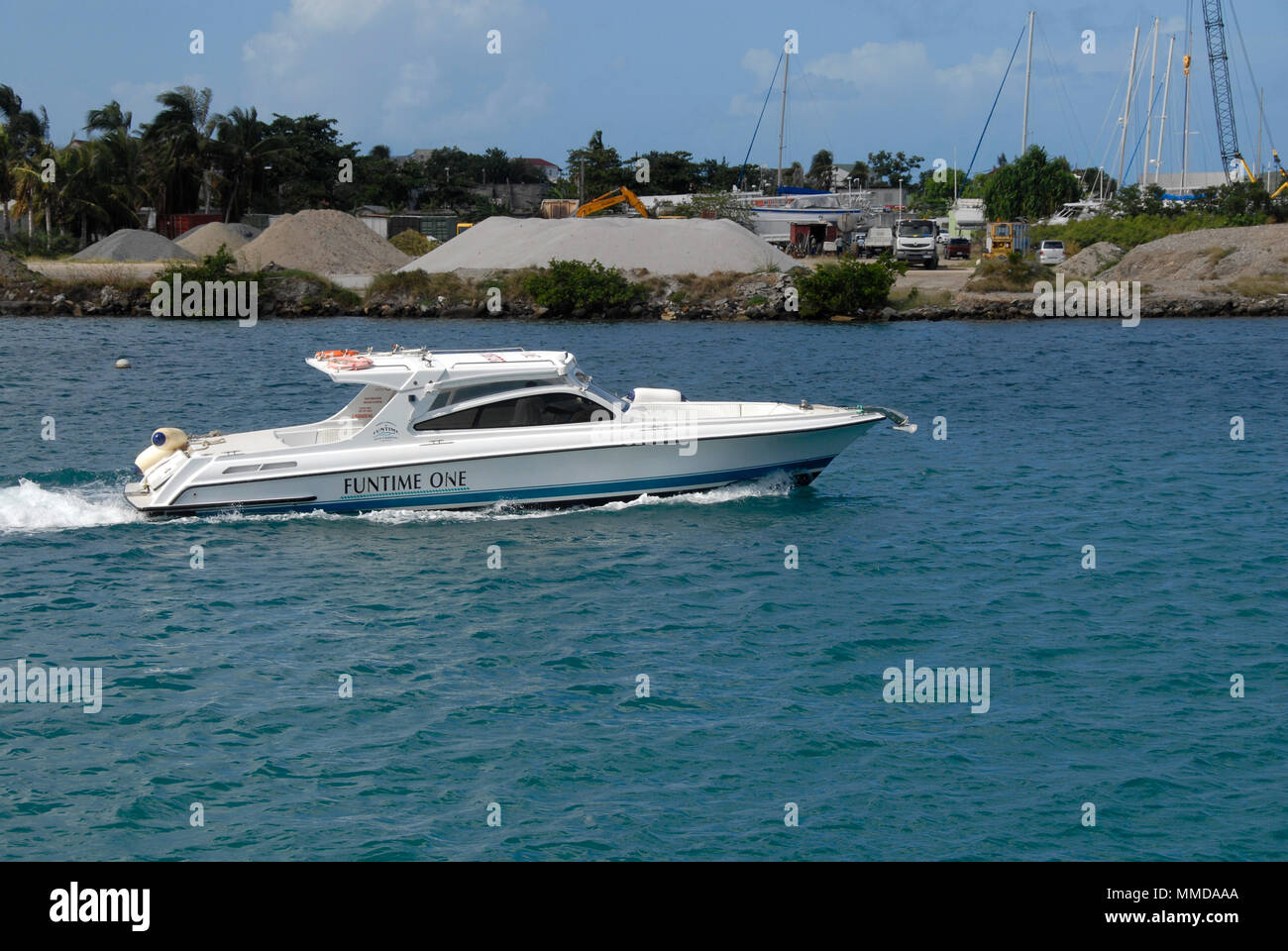 Motor cruiser moving on Simpson Bay, St Martin, Caribbean Stock Photo ... Motor cruiser moving on Simpson Bay, St Martin, Caribbean Stock Photo ...