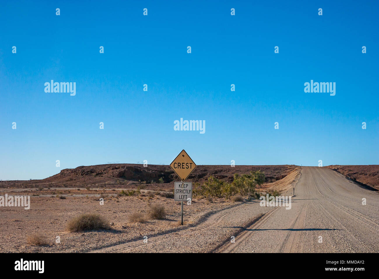 A desolate country road with no traffic but instructions to stay on the ...