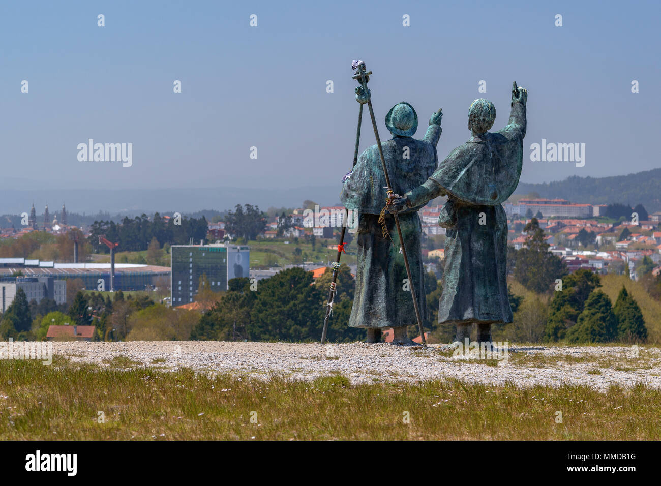 Sculpture of two pilgrims happy to see Santiago de Compostela from the ...