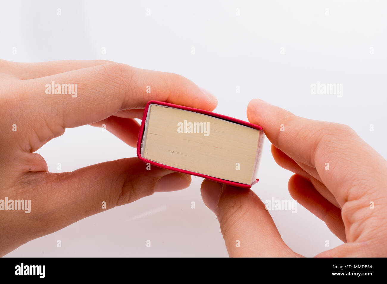 Hand holding The Holy Quran on a white background Stock Photo - Alamy
