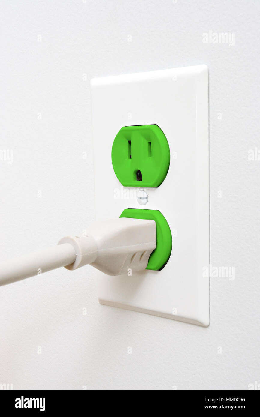 Eco friendly, renewable power, green outlet and gray plug Stock Photo ...