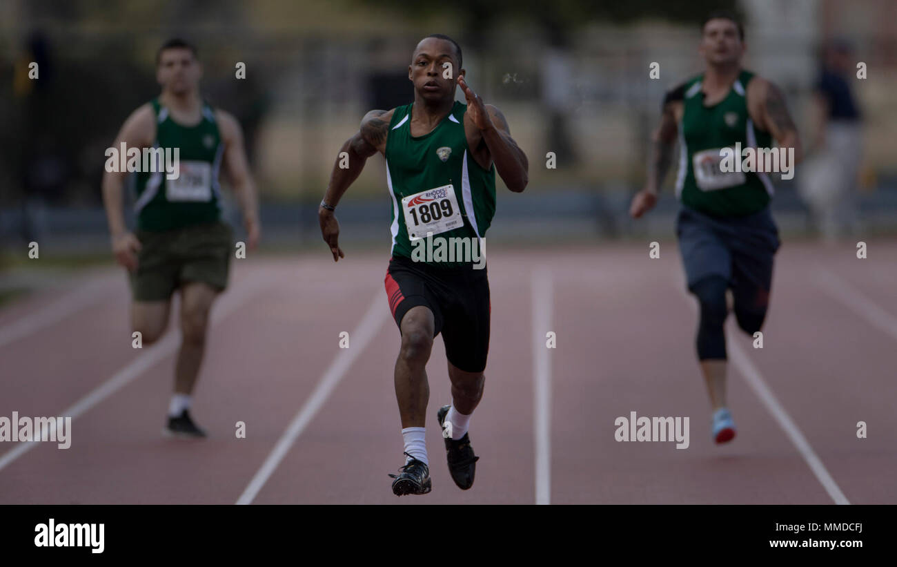 U.S. Marine Corps athletes race down the track as part of the 200-meter ...