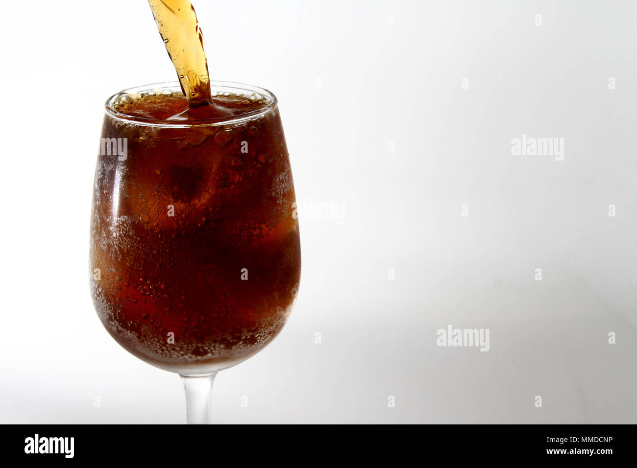 Ice cube with carbonated drink Stock Photo - Alamy