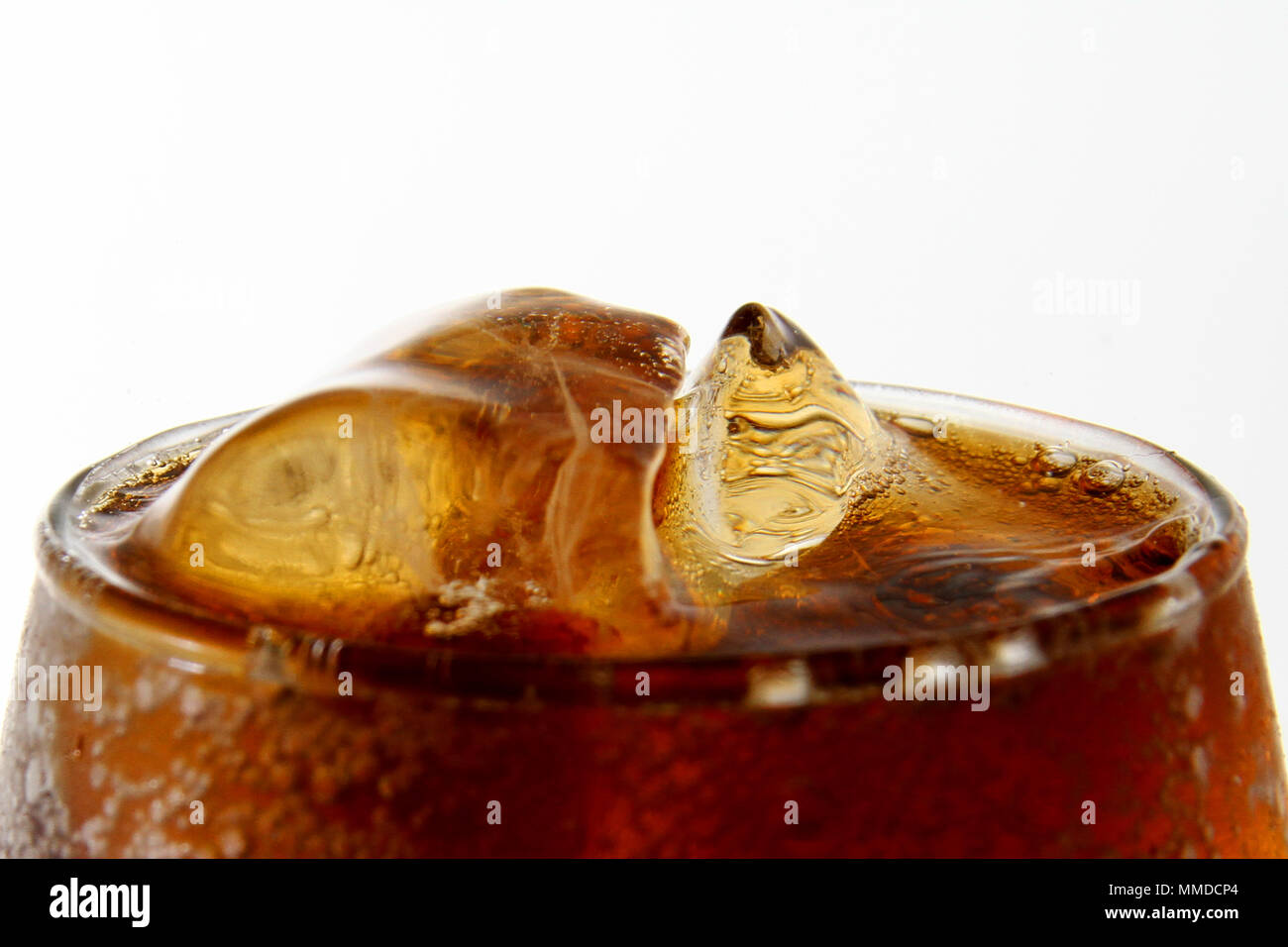 Ice cube with carbonated drink Stock Photo - Alamy