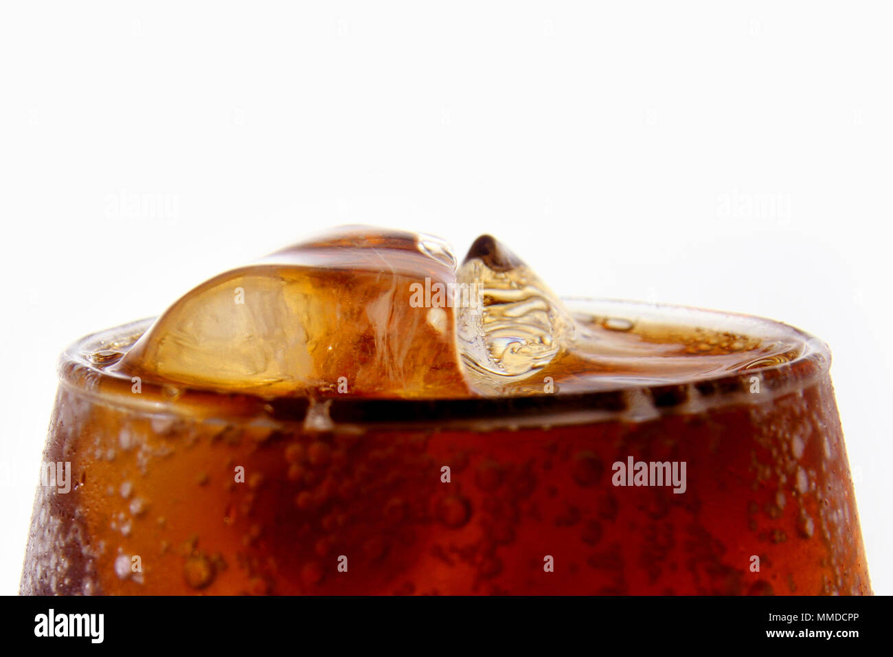 Ice cube with carbonated drink Stock Photo - Alamy