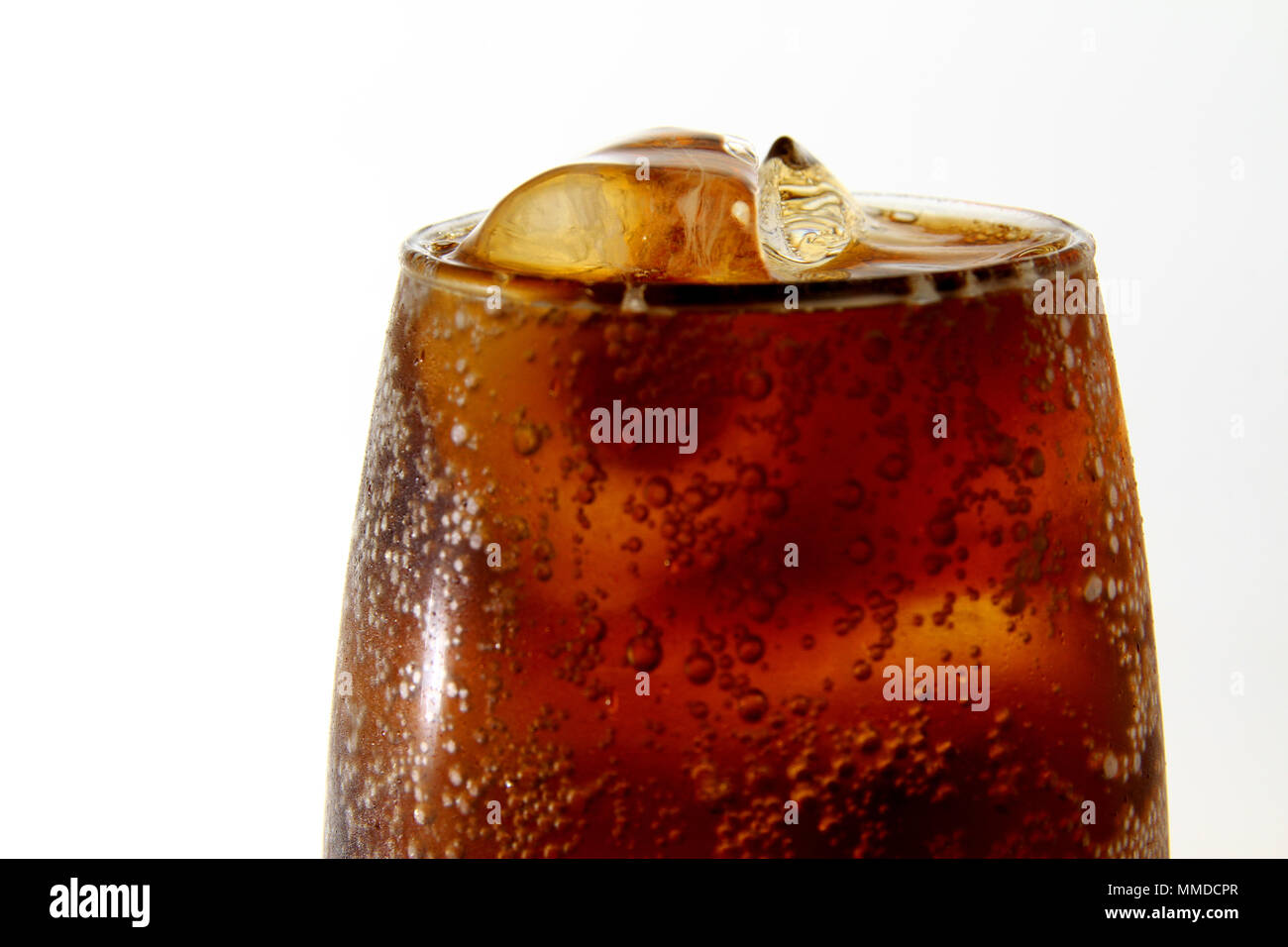 Ice cube with carbonated drink Stock Photo - Alamy